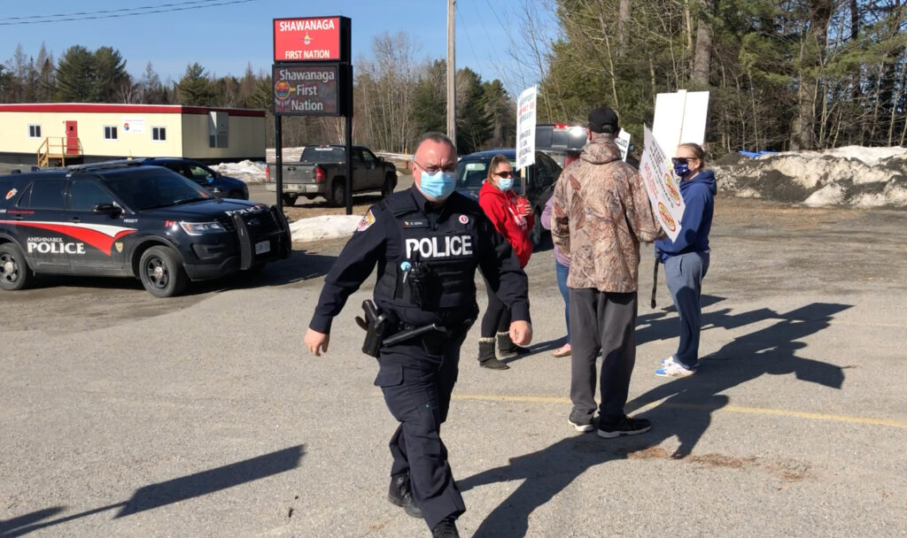 10. cop walking in – Dispensing Freedom